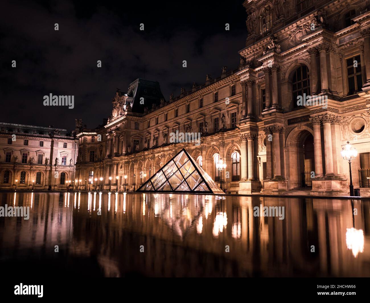 Beautiful view of a Louvre Museum in Paris France during the night ...