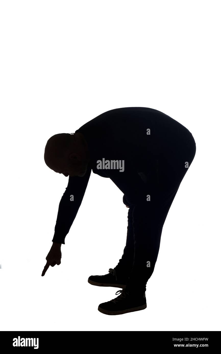 silhouette of a man crouched down on white background Stock Photo - Alamy