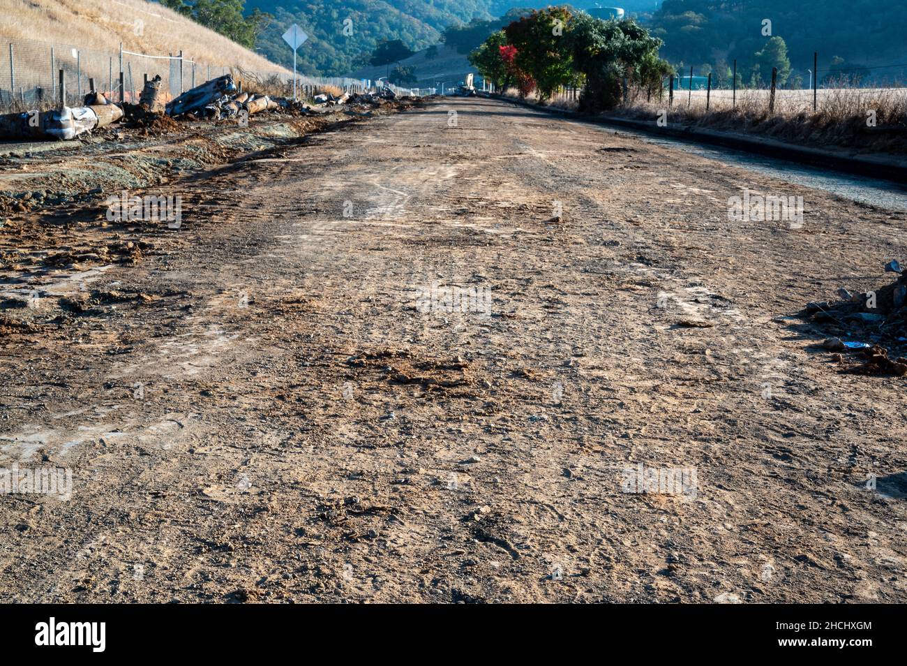 Ruined dusty road under construction Stock Photo - Alamy