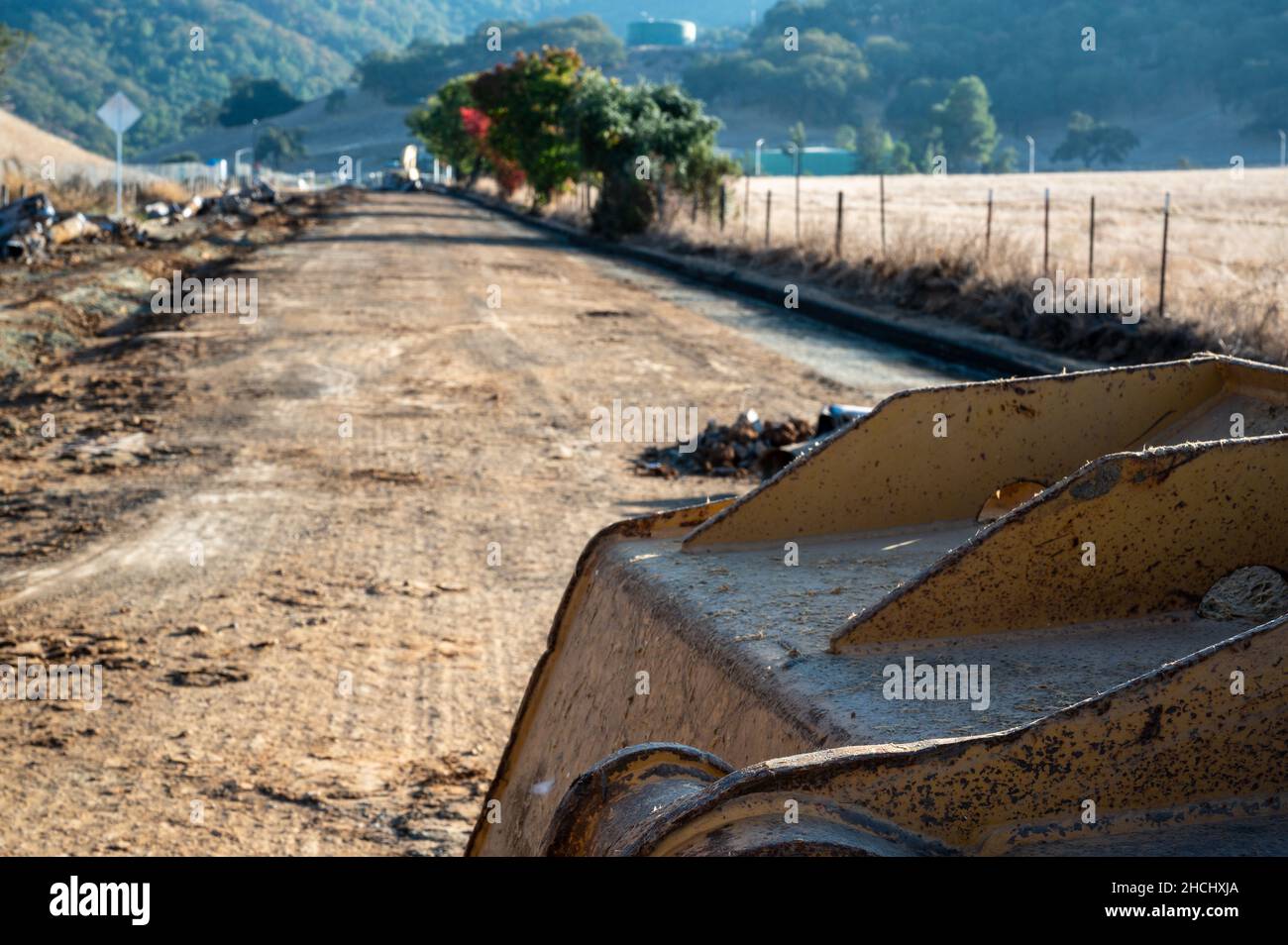 Ruined dusty road under construction Stock Photo - Alamy