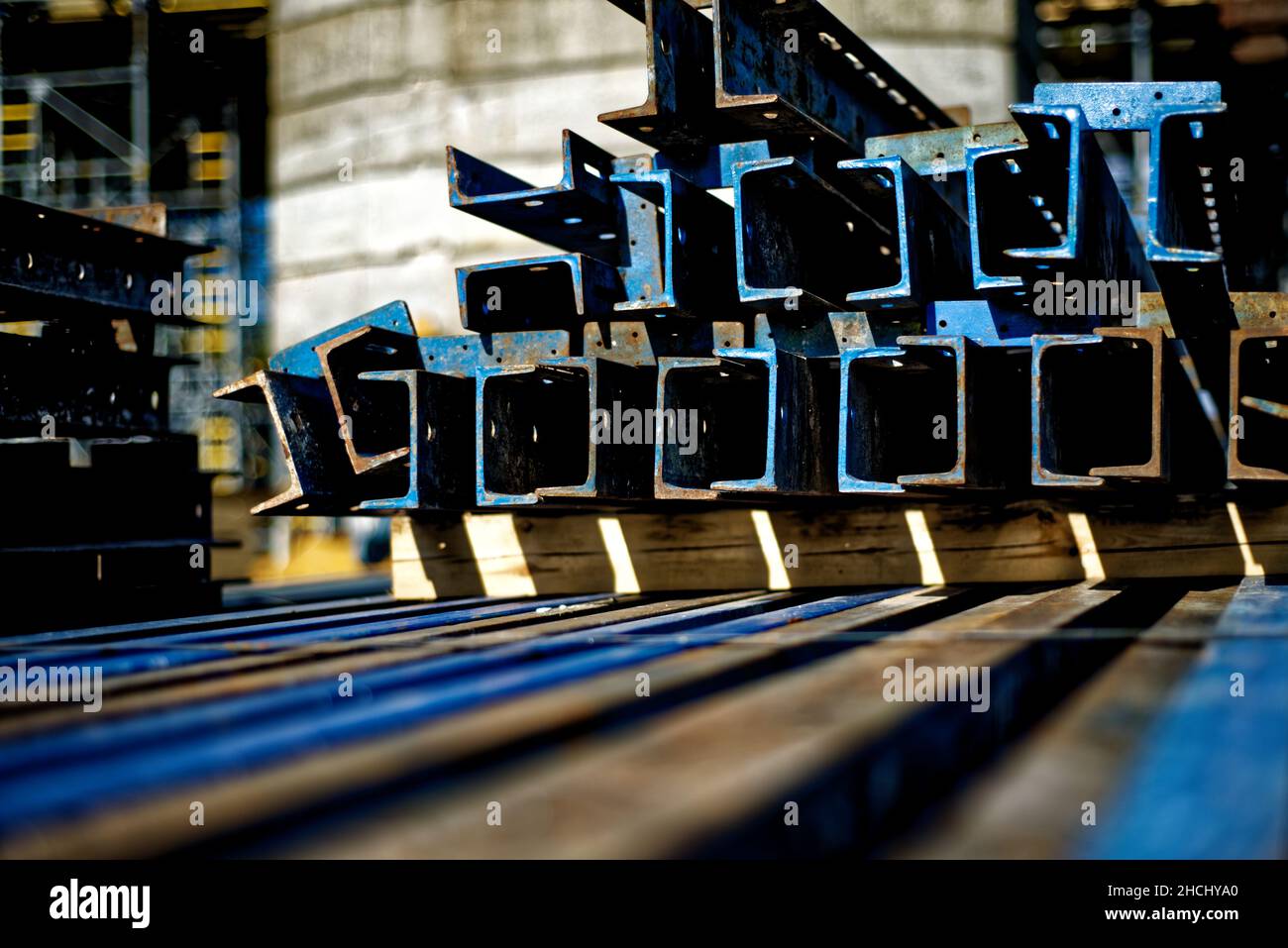 Closeup of rusted metal profile pipes of rectangular shaped cut in half ...
