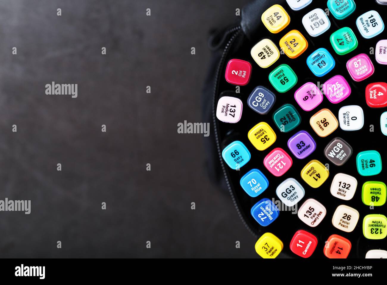 Professional sketching markers of different colors in a bag on a dark ...