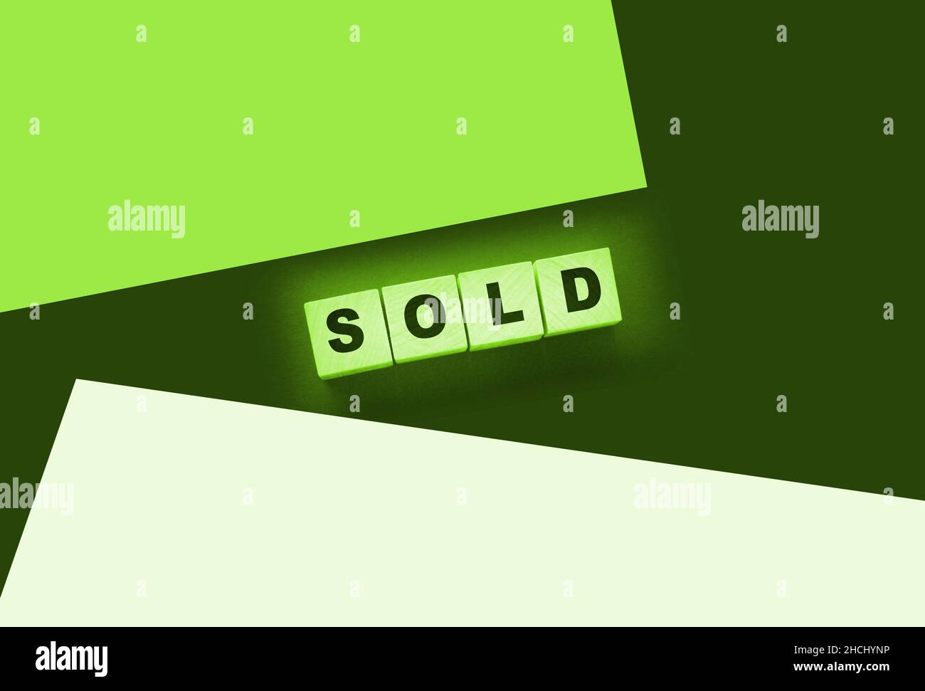 Sold Word Written In Wooden Cubes on black background. Real estate ...