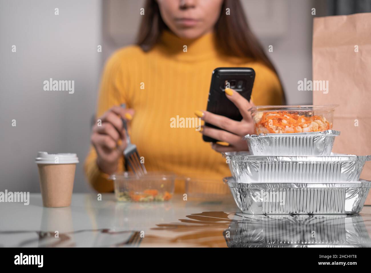 Portrait of a woman relaxing at home at the table after office work ...