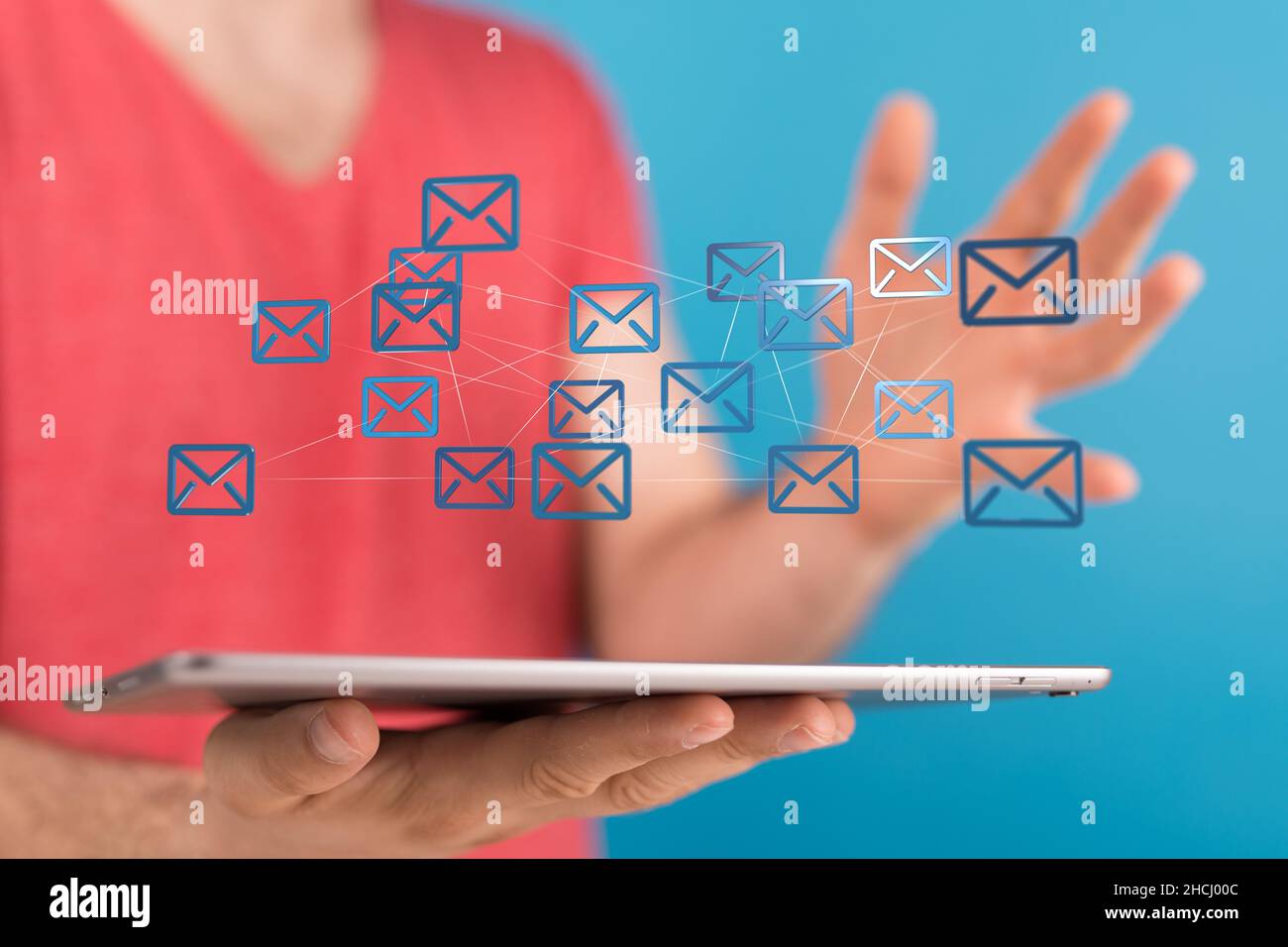 Closeup shot of a tablet with digital email icons above Stock Photo - Alamy