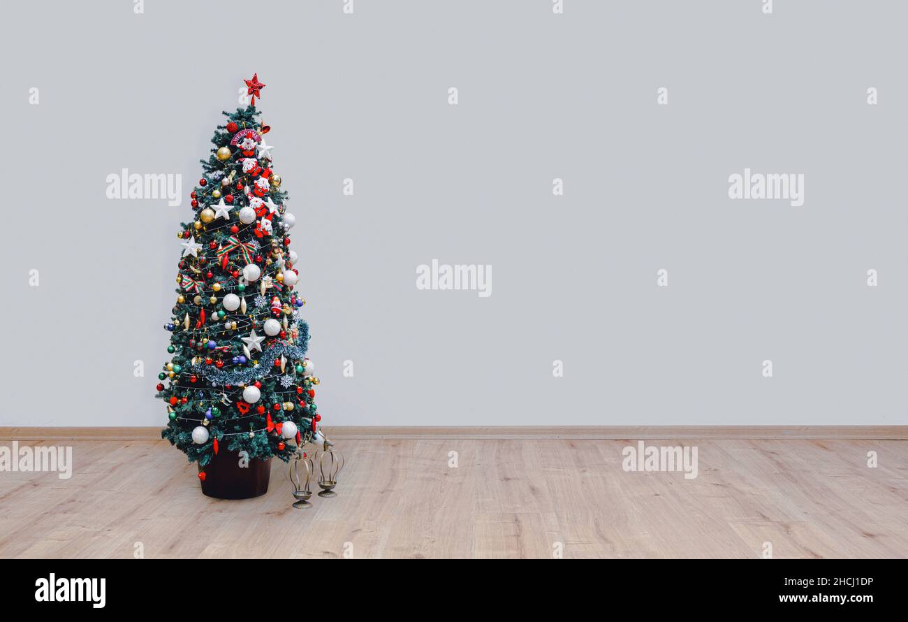 christmas tree on hardwood floor Stock Photo - Alamy