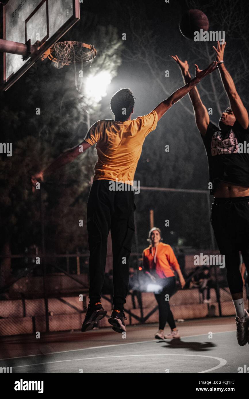 Basketball players captured in the moment of slam dunk Stock Photo - Alamy