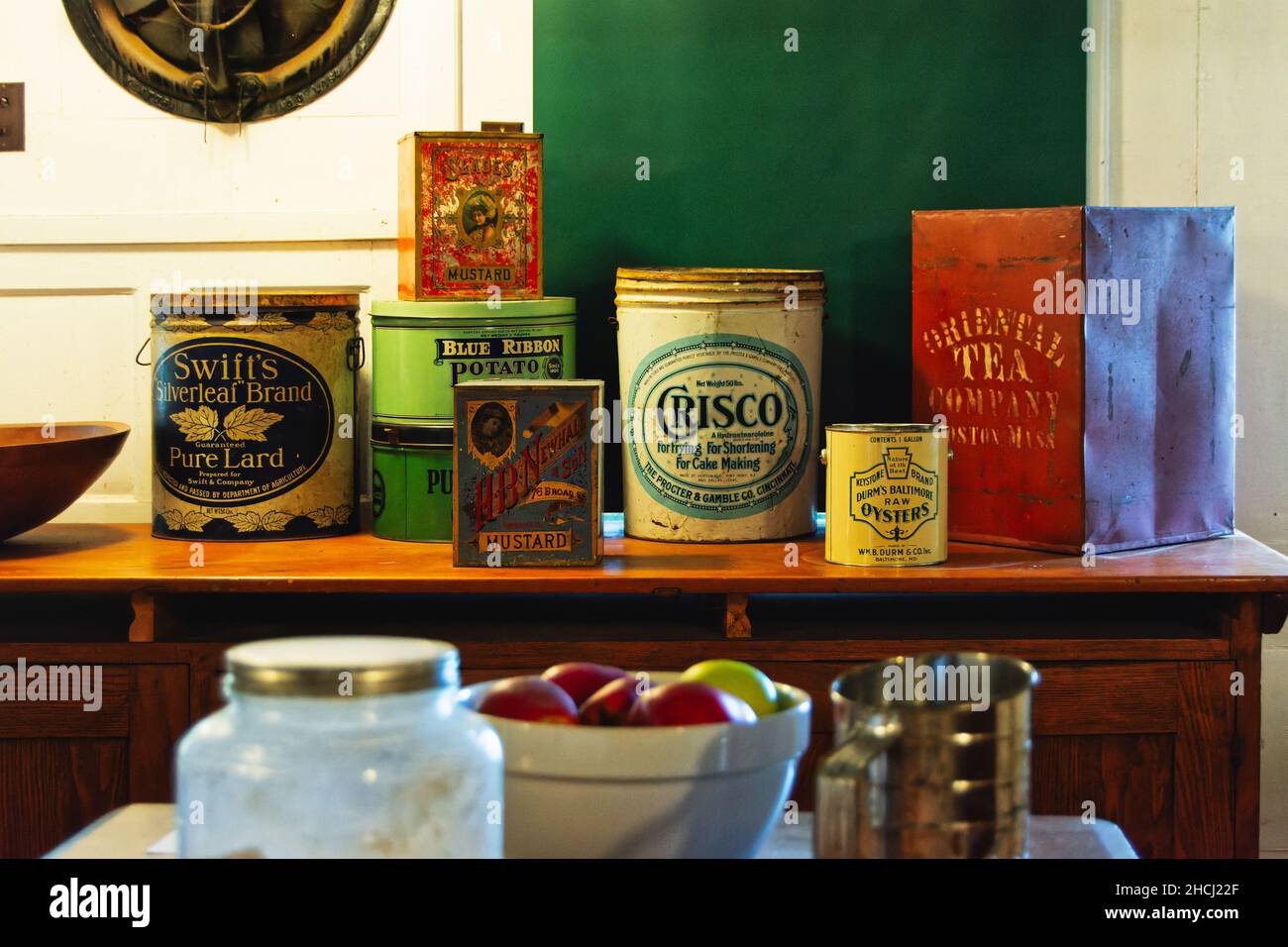 A group of vintage cooking ingredient containers is displayed on a ...