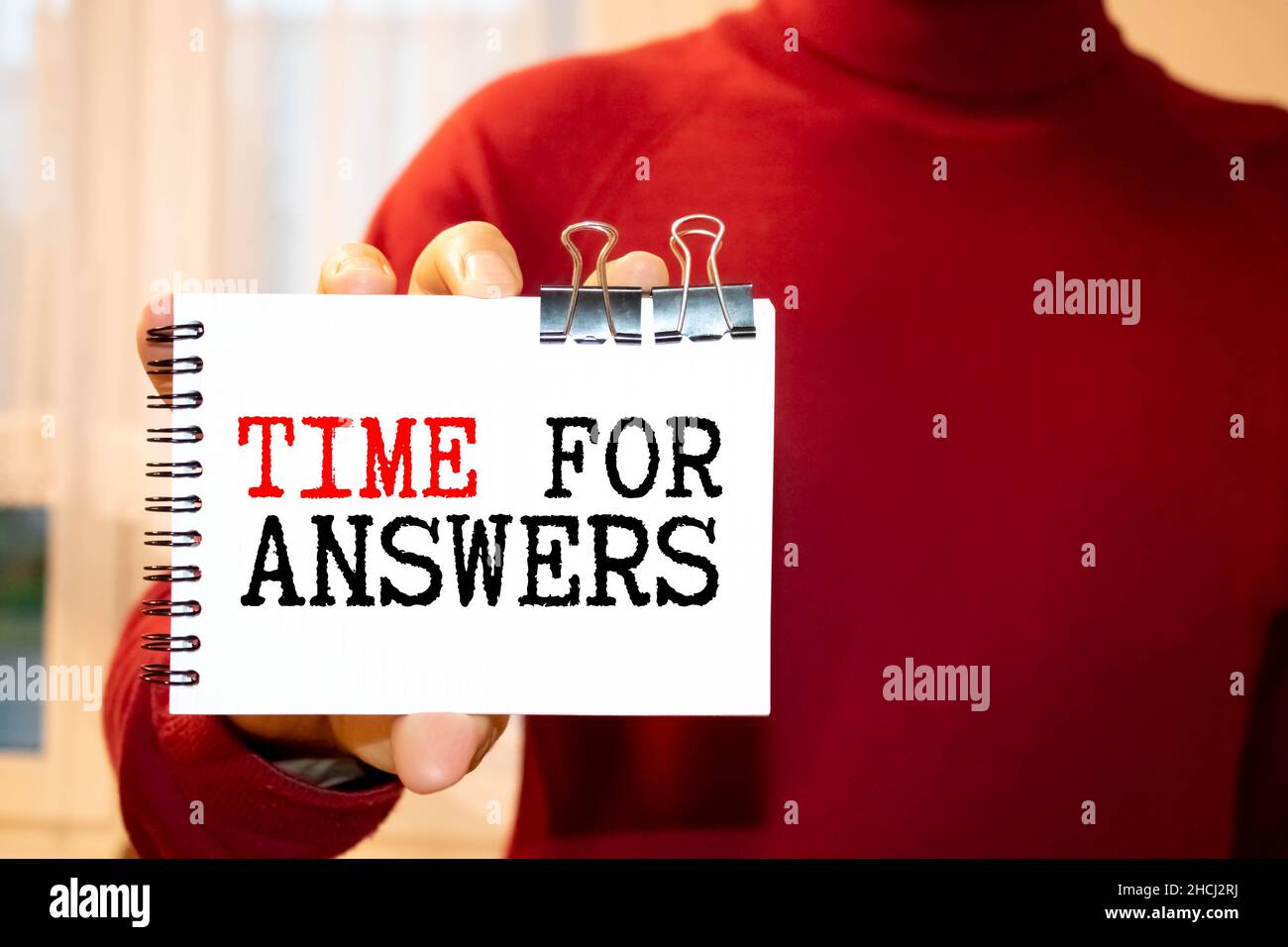 On a pink background, pen and notebook with the text TIME FOR ANSWERS ...