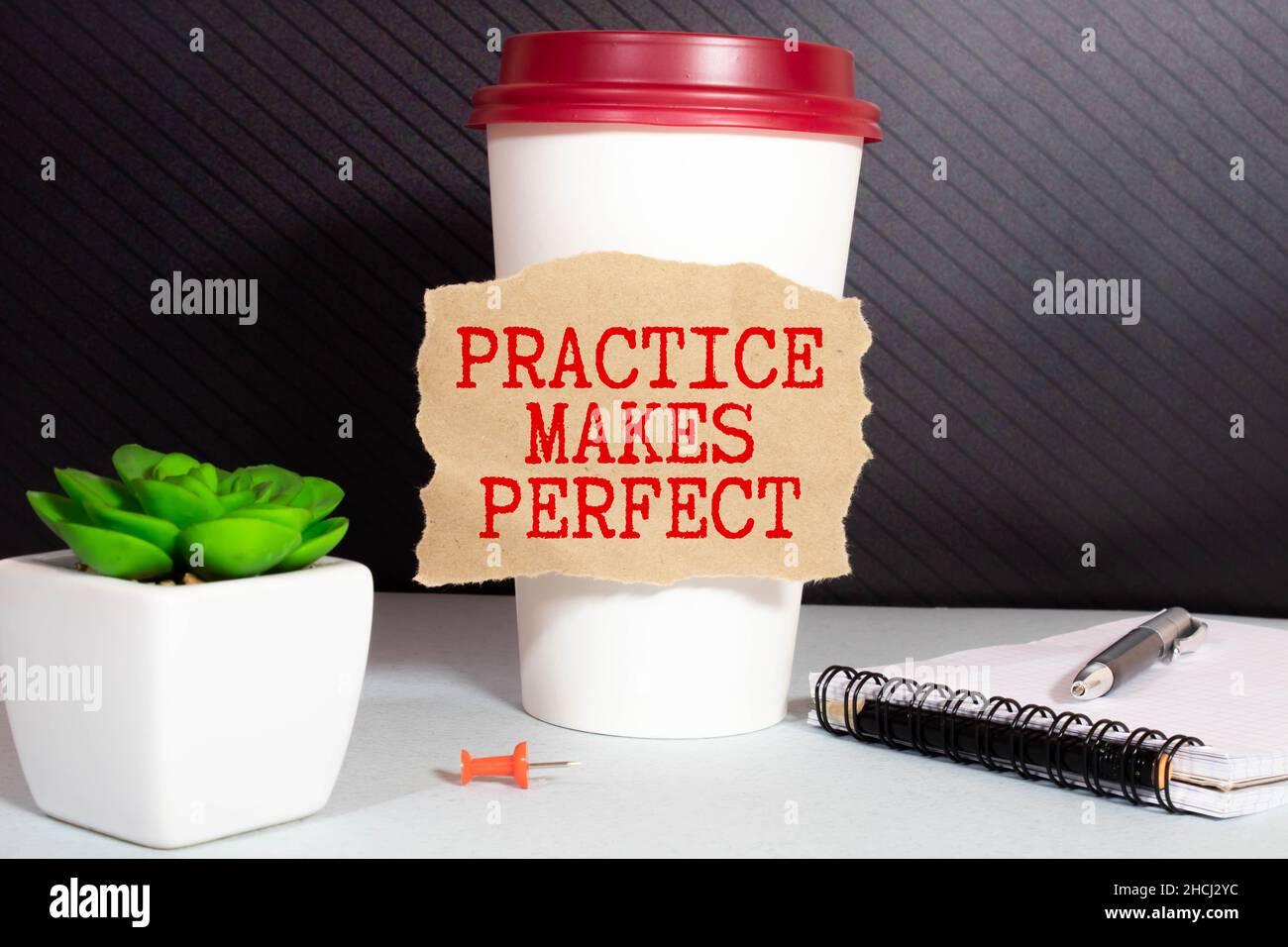practice makes perfect - a motivational slogan on a green stocky note ...