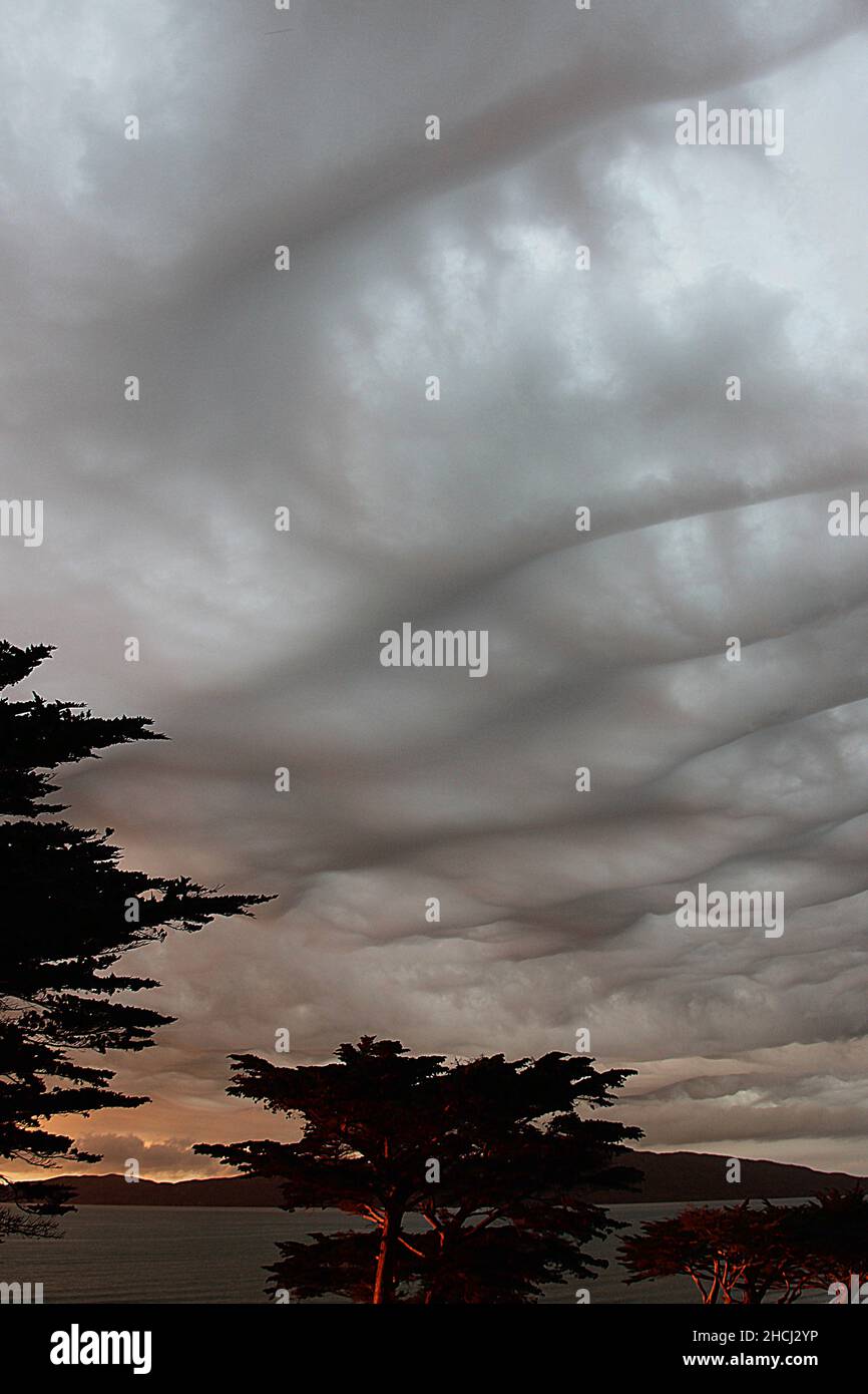 Storm cloud formations at sunset Stock Photo - Alamy
