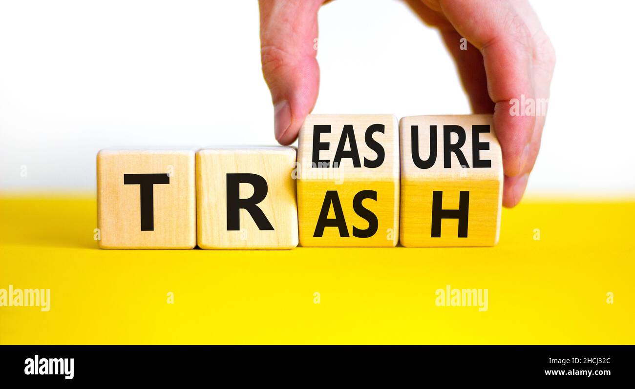 Trash to treasure symbol. Businessman turns cubes and changes the word ...