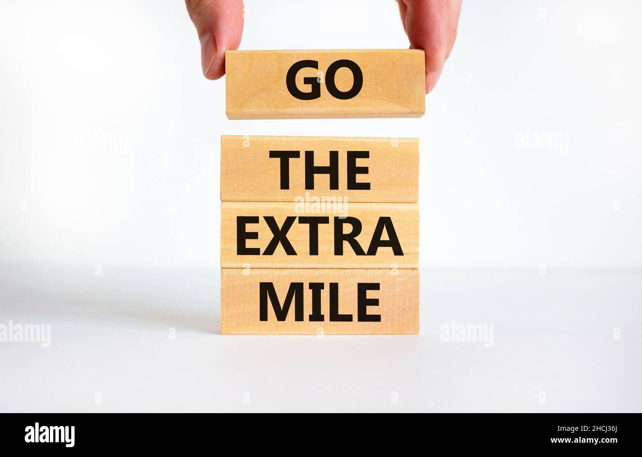 Go the extra mile symbol. Concept words Go the extra mile on wooden ...