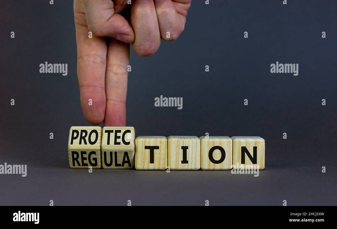 Protection and regulation symbol. Businessman turns cubes changes the ...