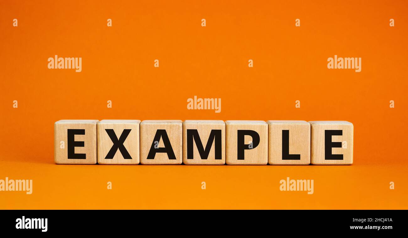 Example symbol. The concept word Example on wooden cubes. Beautiful ...