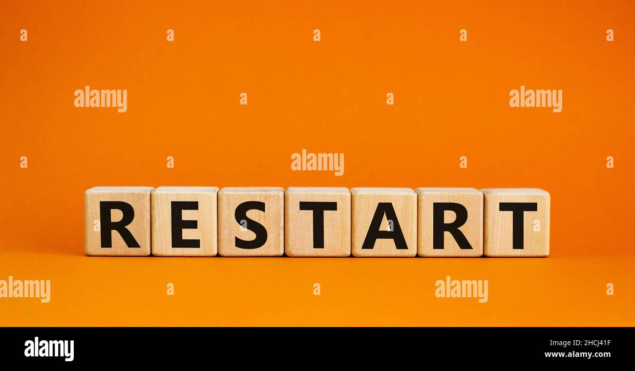 Restart and start symbol. The concept word Restart on wooden cubes ...