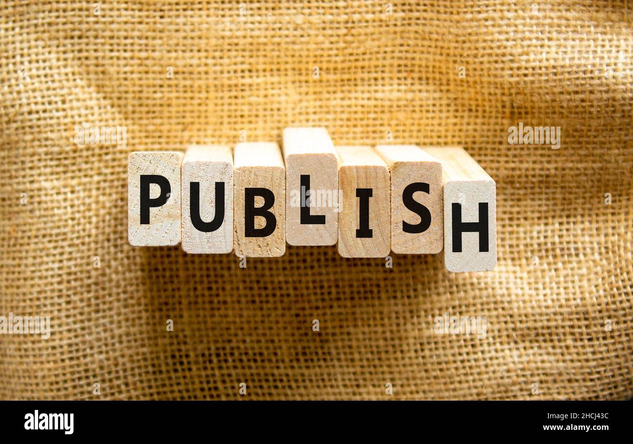 Publish symbol. The concept word Publish on wooden blocks. Beautiful ...