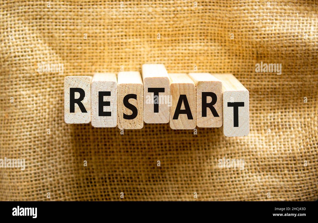 Restart and start symbol. The concept word Restart on wooden blocks ...