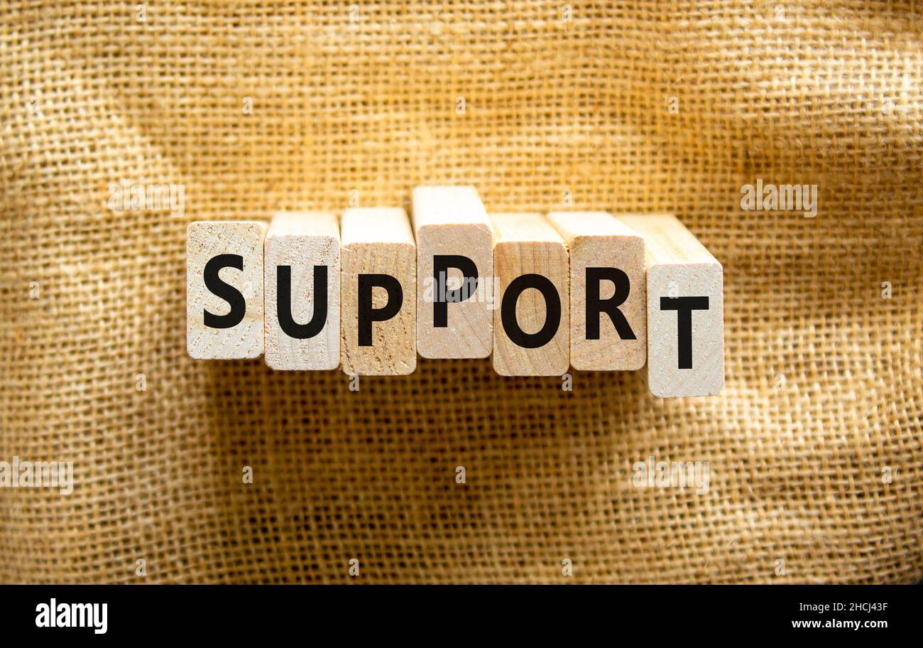 Support symbol. The concept word Support on wooden blocks. Beautiful ...