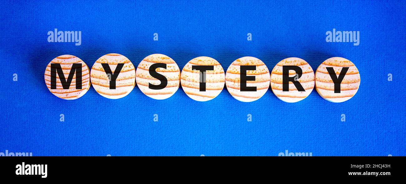 Mystery symbol. The concept word Mystery on wooden circles. Beautiful ...