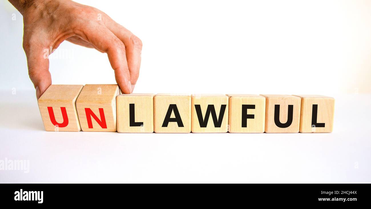 Lawful or unlawful symbol. Businessman turns wooden cubes and changes ...