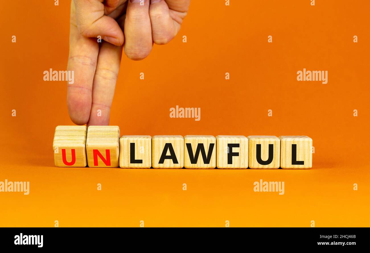 Lawful or unlawful symbol. Businessman turns wooden cubes and changes ...
