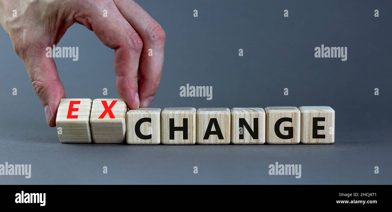Change or exchange symbol. Businessman turns wooden cubes and changes ...
