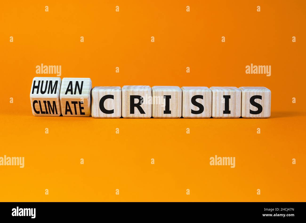 Climate or human crisis symbol. Turned wooden cubes and changed words ...