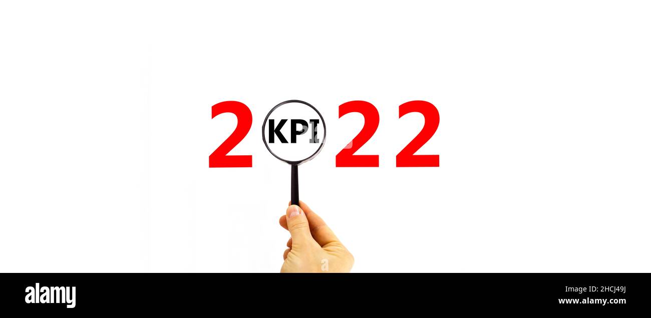 2022 KPI, key performance indicator new year symbol. Businessman holds ...