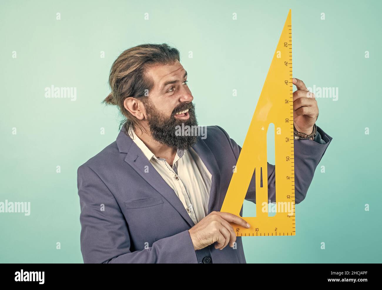 mature bearded man teacher in costume sit in school classroom with ...