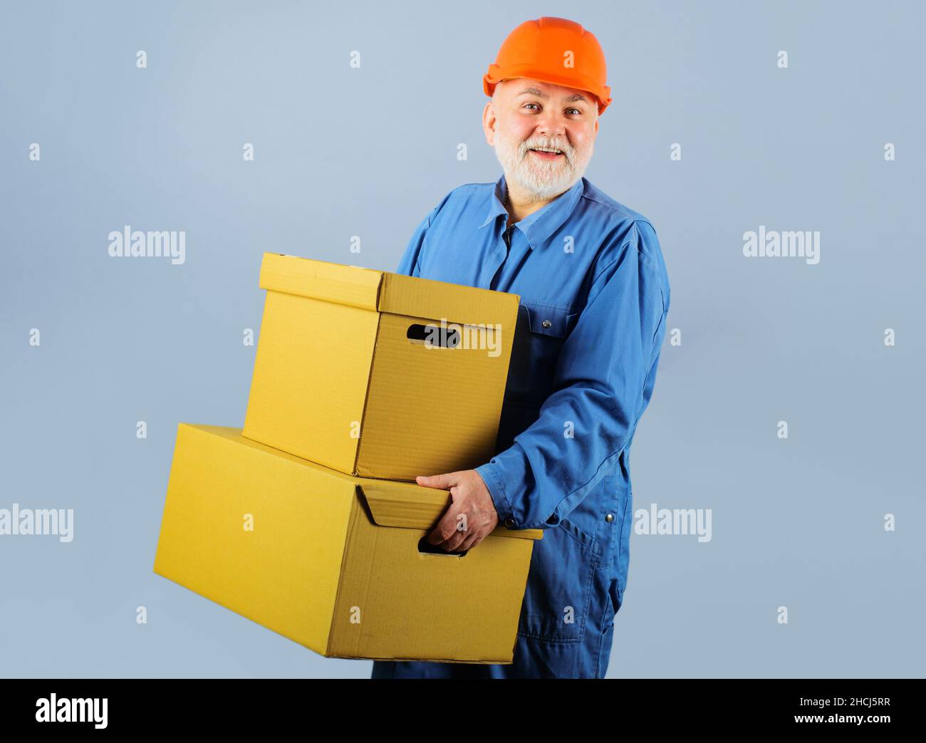 Shipment. Smiling man with cardboard boxes. Delivery service. Bearded ...