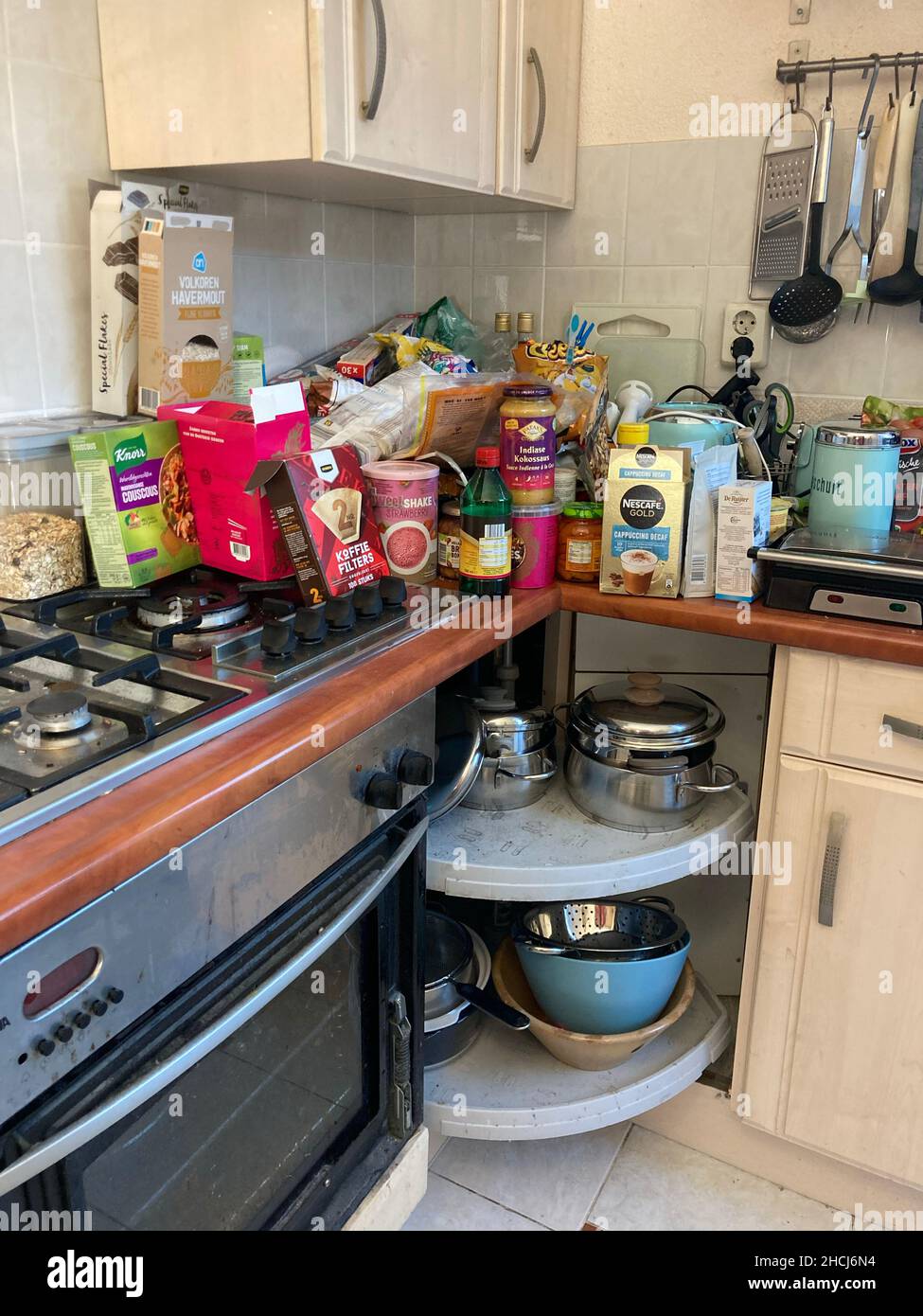 Kitchen with piles of food packaging leaving no shelf space Stock Photo ...