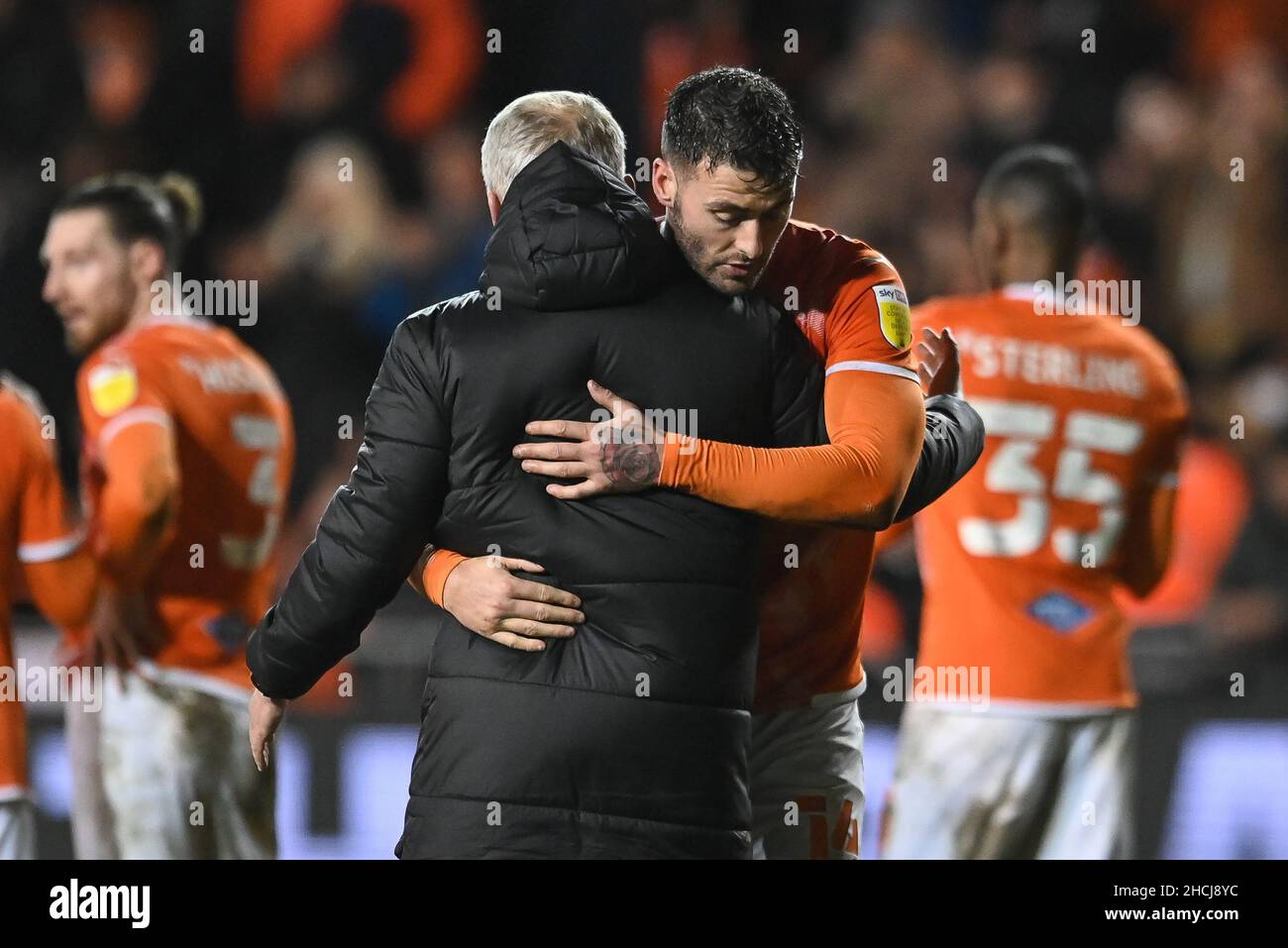 Neil Critchley manager of Blackpool embraces Gary Madine #14 after the ...