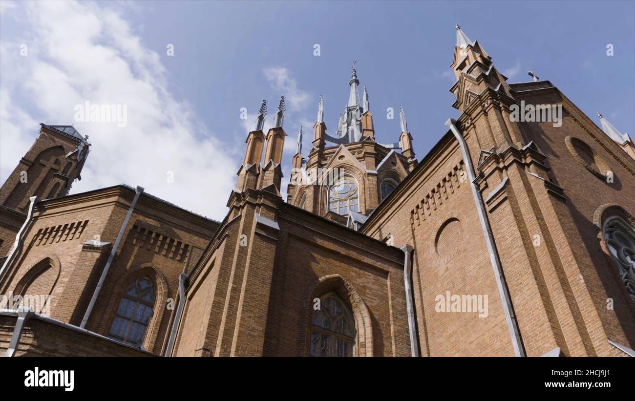 Beautiful view of an ancient cathedral on blue cloudy sky background ...