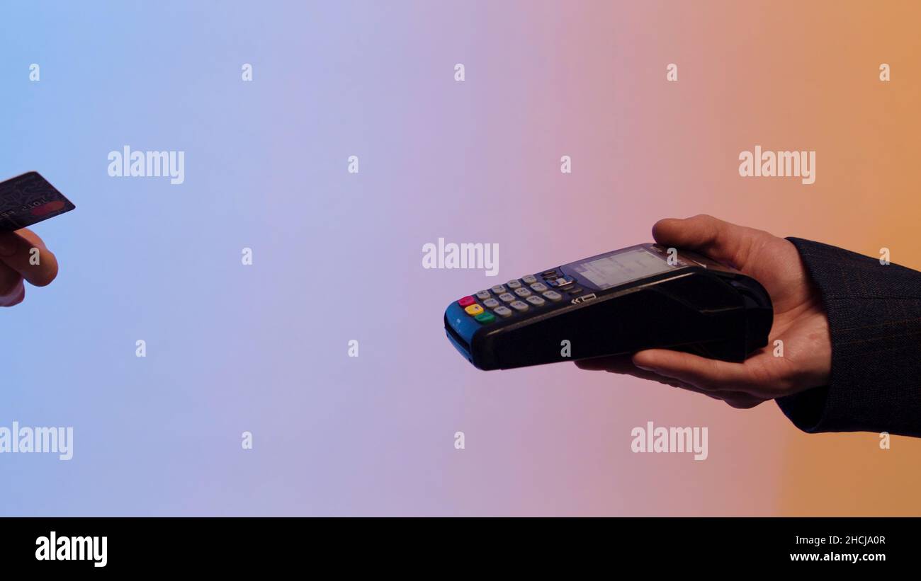 Payment with magnetic stripe credit card through the terminal, isolated ...