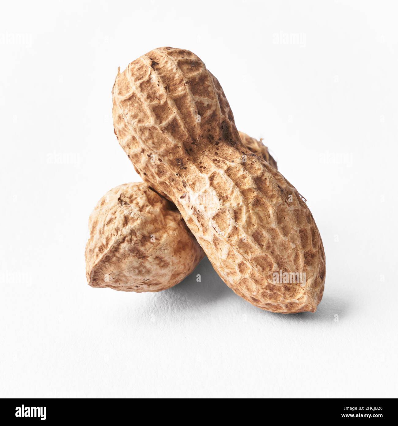Two peanuts with shell isolated on a white background Stock Photo - Alamy