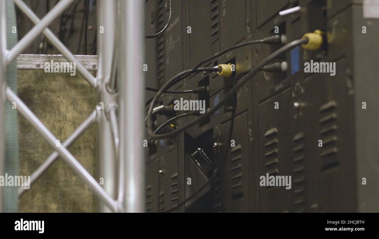 Electrician engineer tests electrical installations and wires on relay ...
