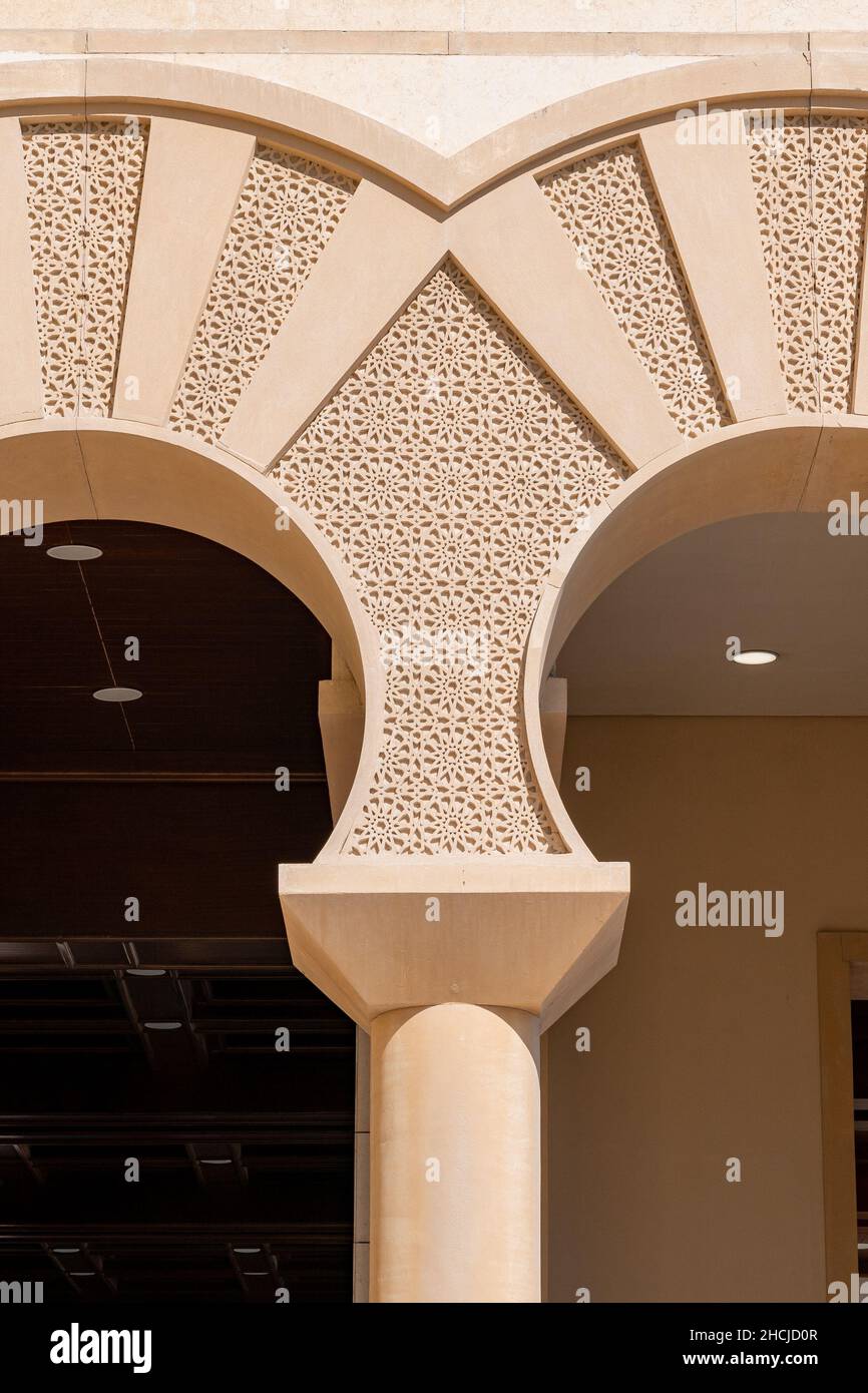 Low angle of a decorated architecture pole and wall with on a sunny day ...