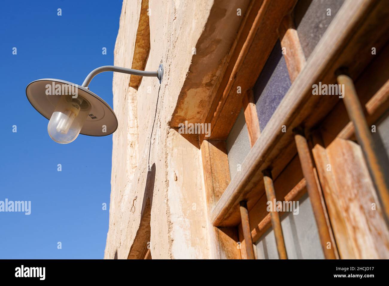 Low angle of a Vintage Industrial Stable Lamp Outdoor on the wall ...