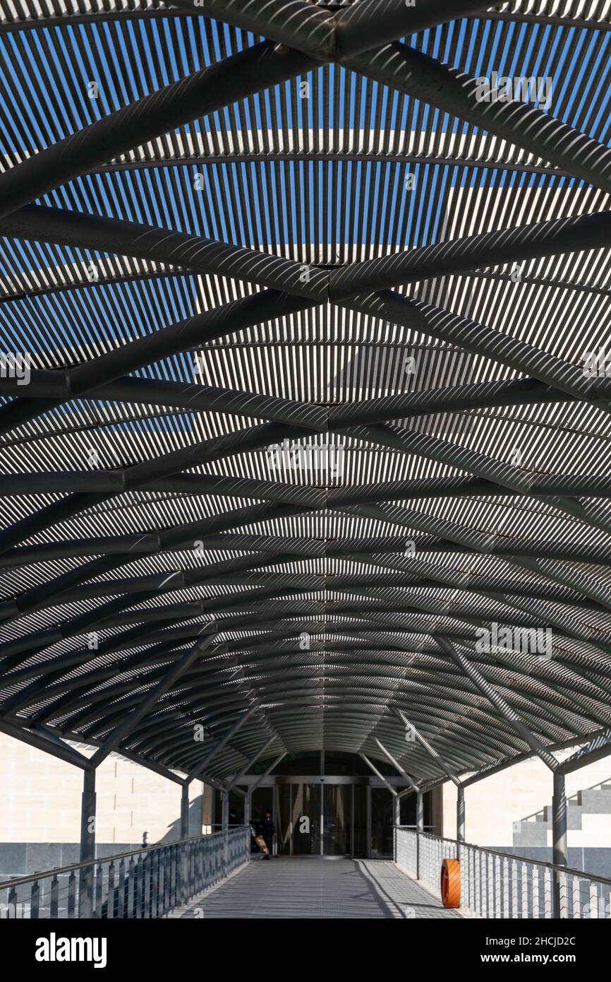 Beautiful Modern pedestrian bridge covered with metal ceil with net ...