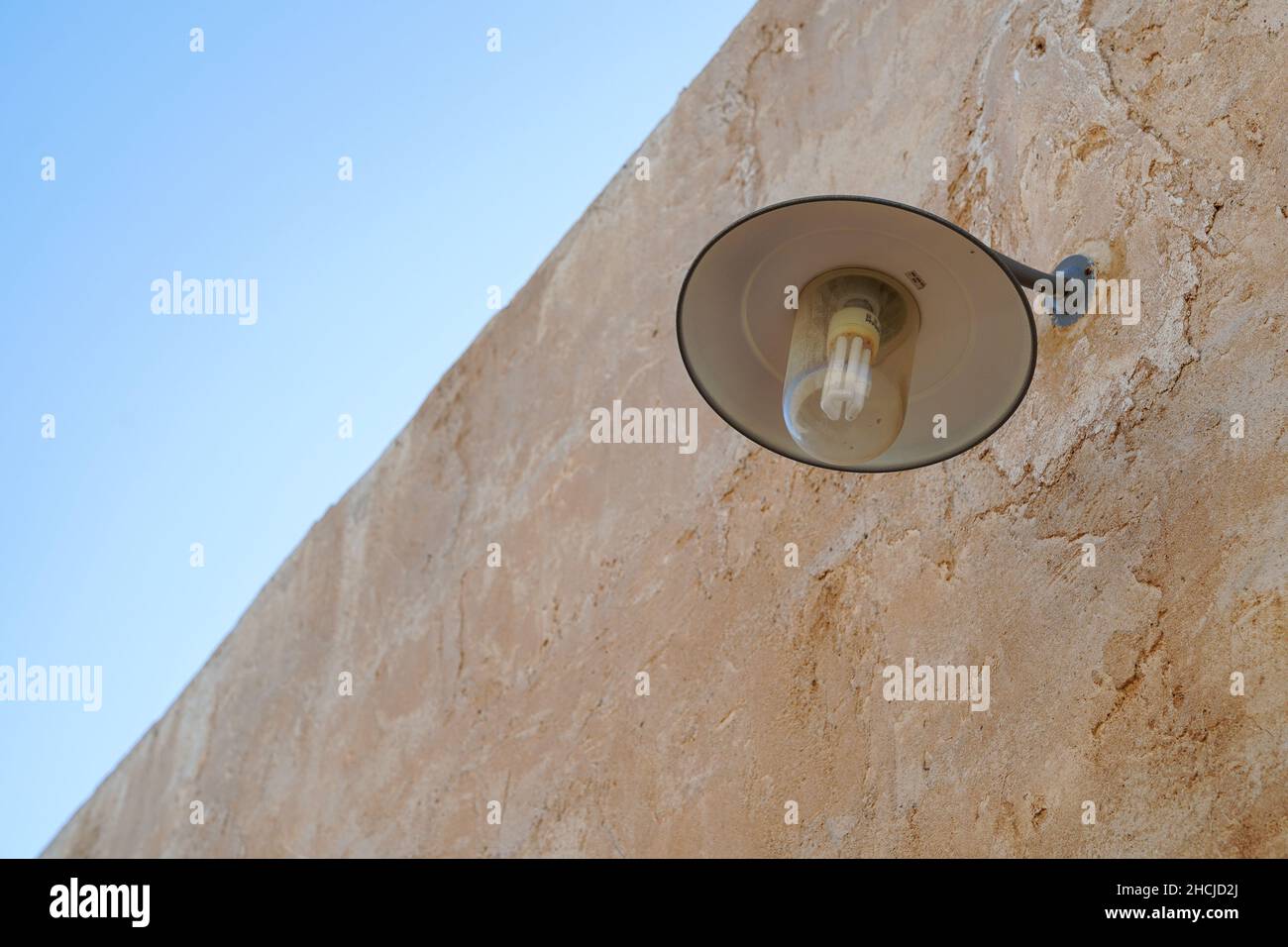 Low angle of a Vintage Industrial Stable Lamp Outdoor on the wall ...