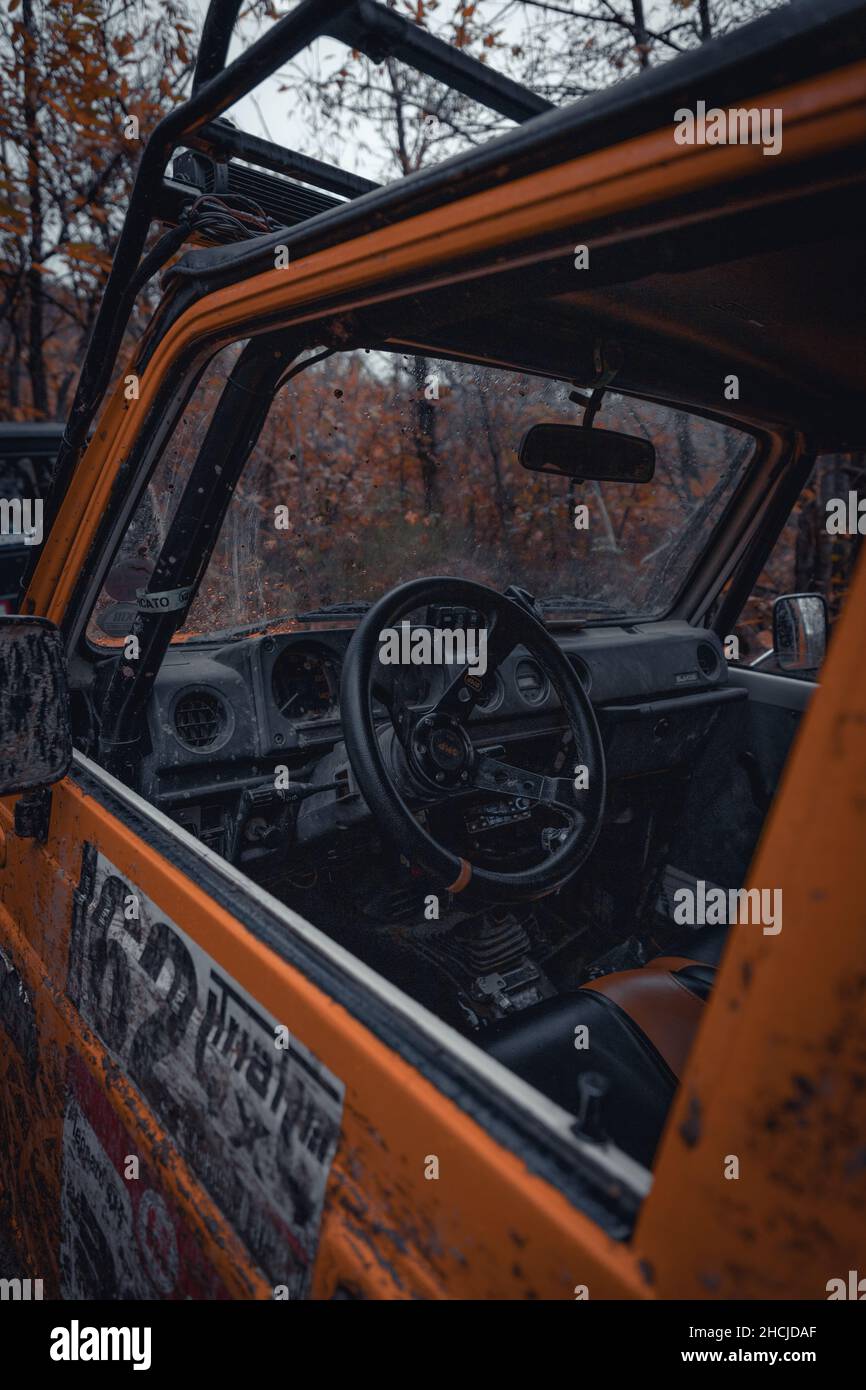 Off-road black car driving in the dark forest Stock Photo - Alamy