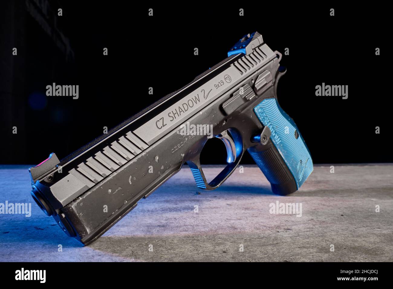 Closeup shot of a black Glock on the black background Stock Photo - Alamy