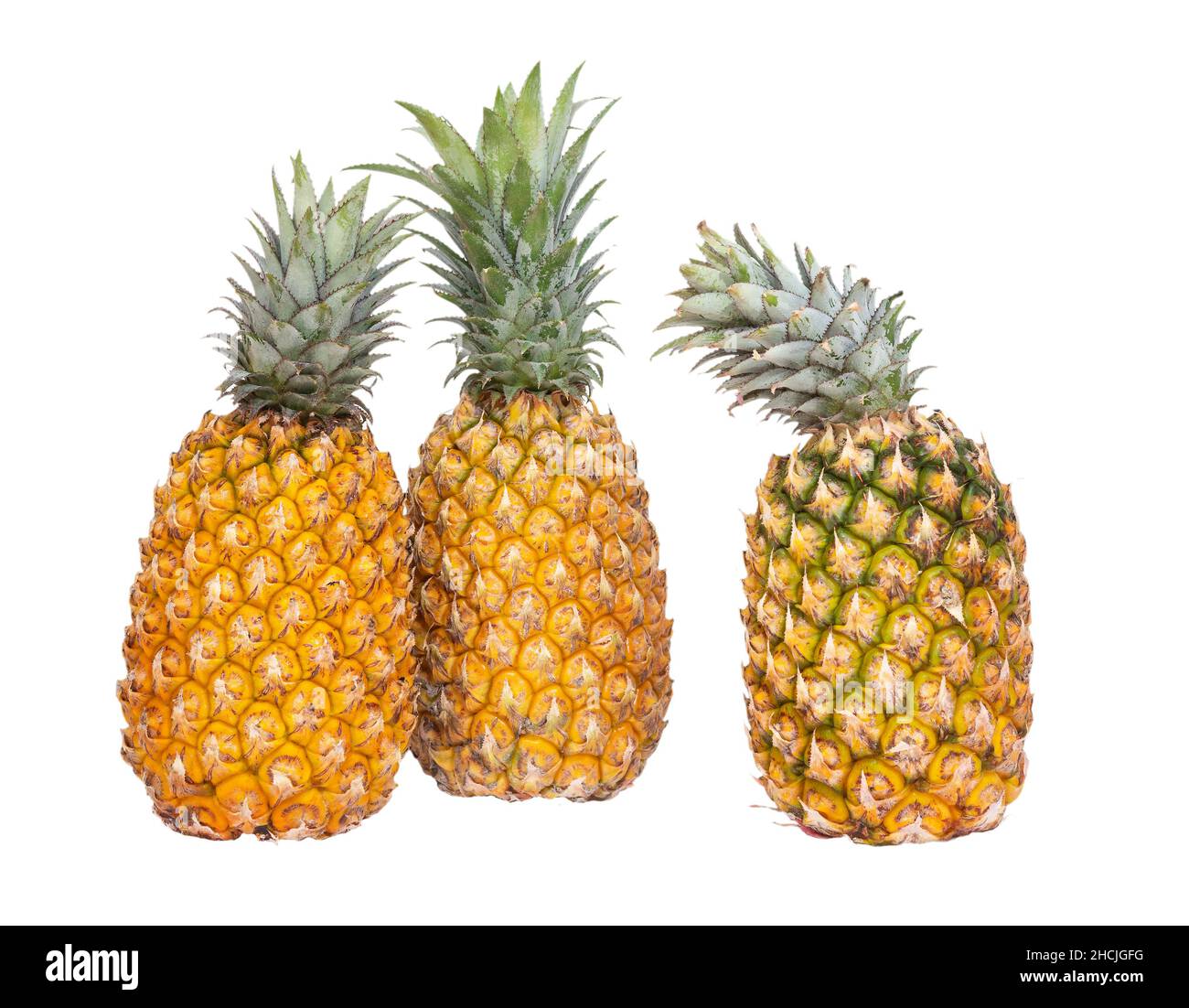 Three fresh pineapples isolated on white background Stock Photo - Alamy