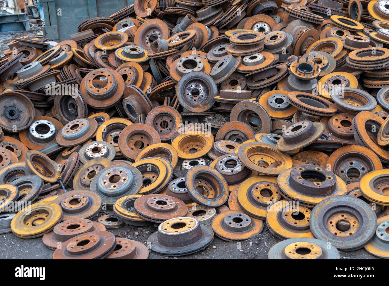 Old car wheels rusting in a scrap metal yard Stock Photo - Alamy