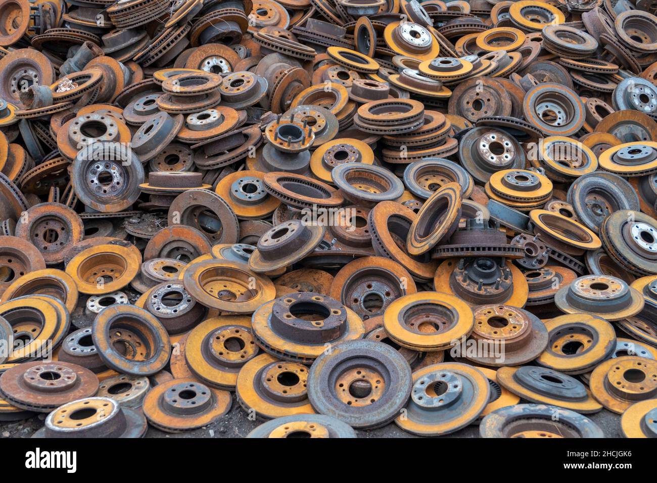 Old car wheels rusting in a scrap metal yard Stock Photo - Alamy