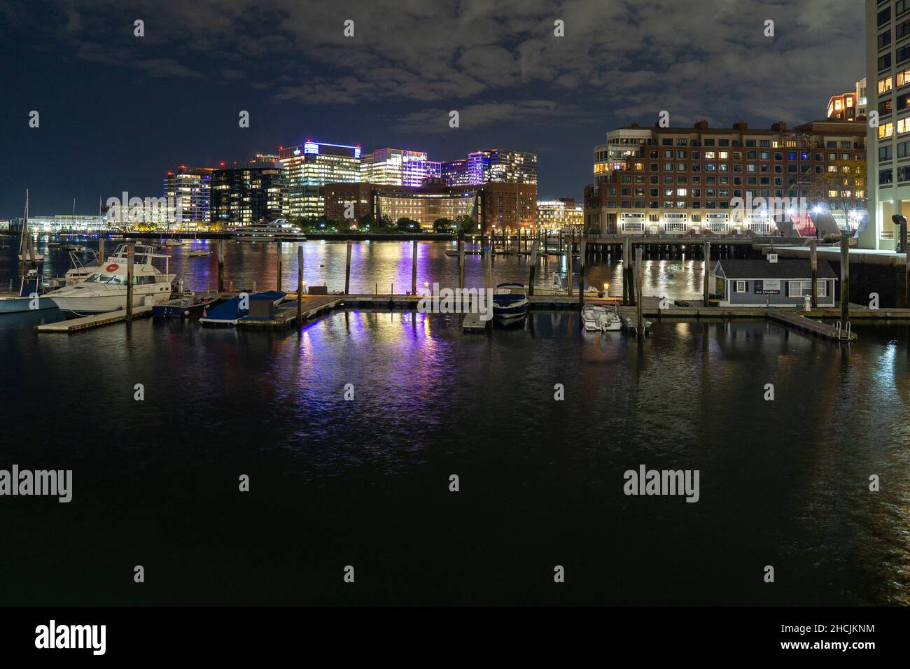 View of lights in the buildings at night seen from Boston Harbor deck ...