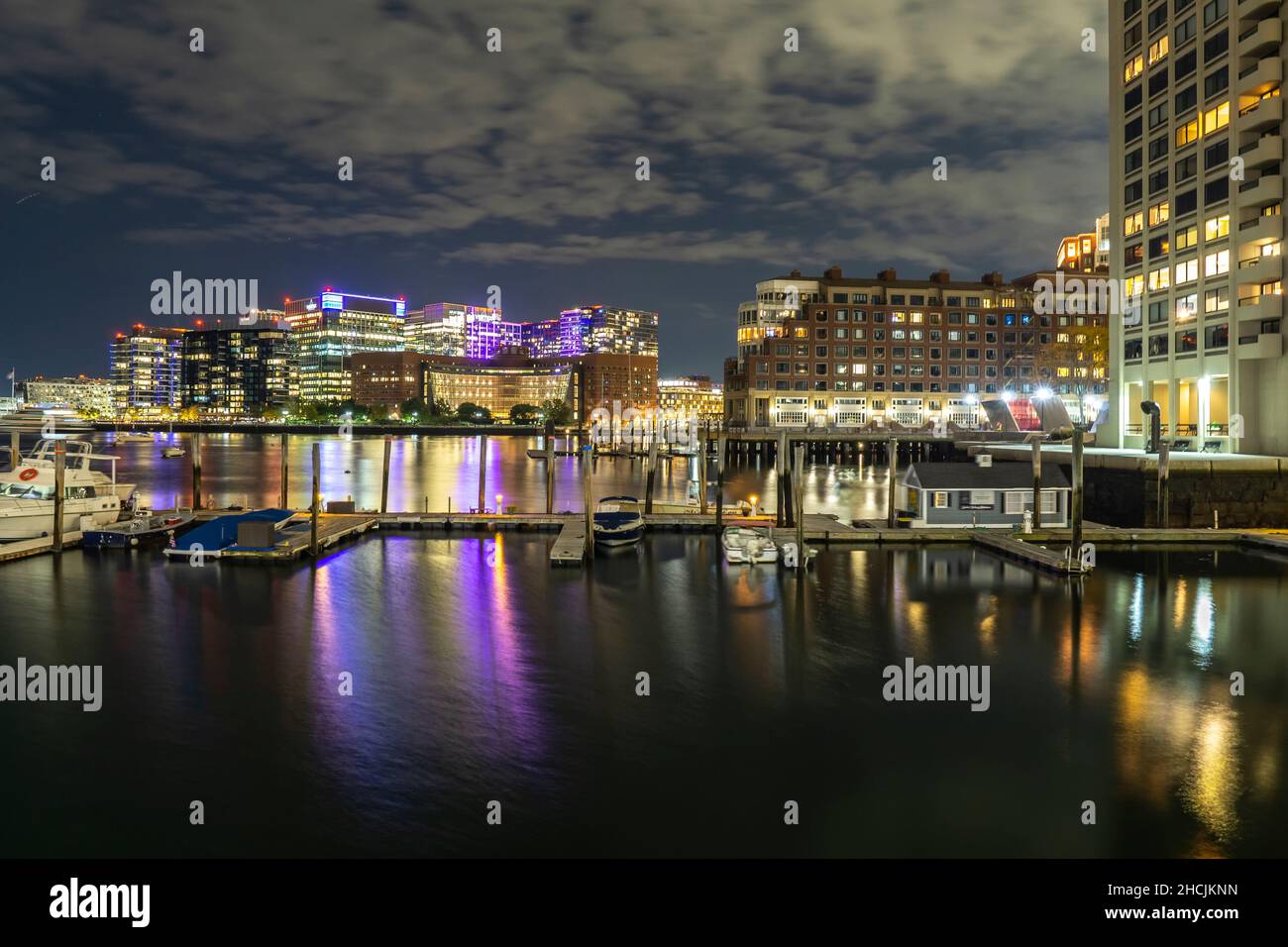 View of lights in the buildings at night seen from Boston Harbor deck ...
