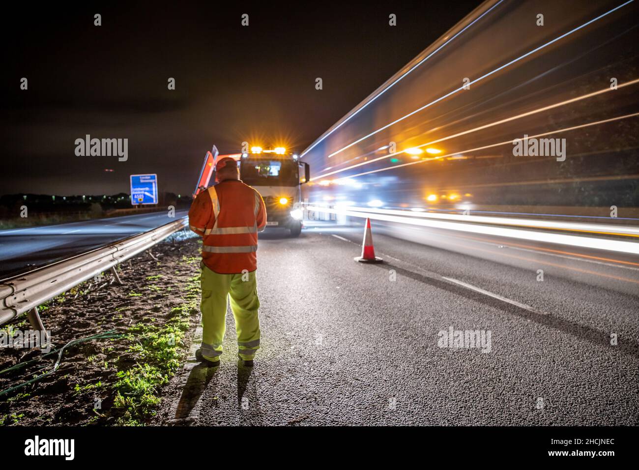Motorway Worker on a Closed Section of Road Stock Photo - Alamy