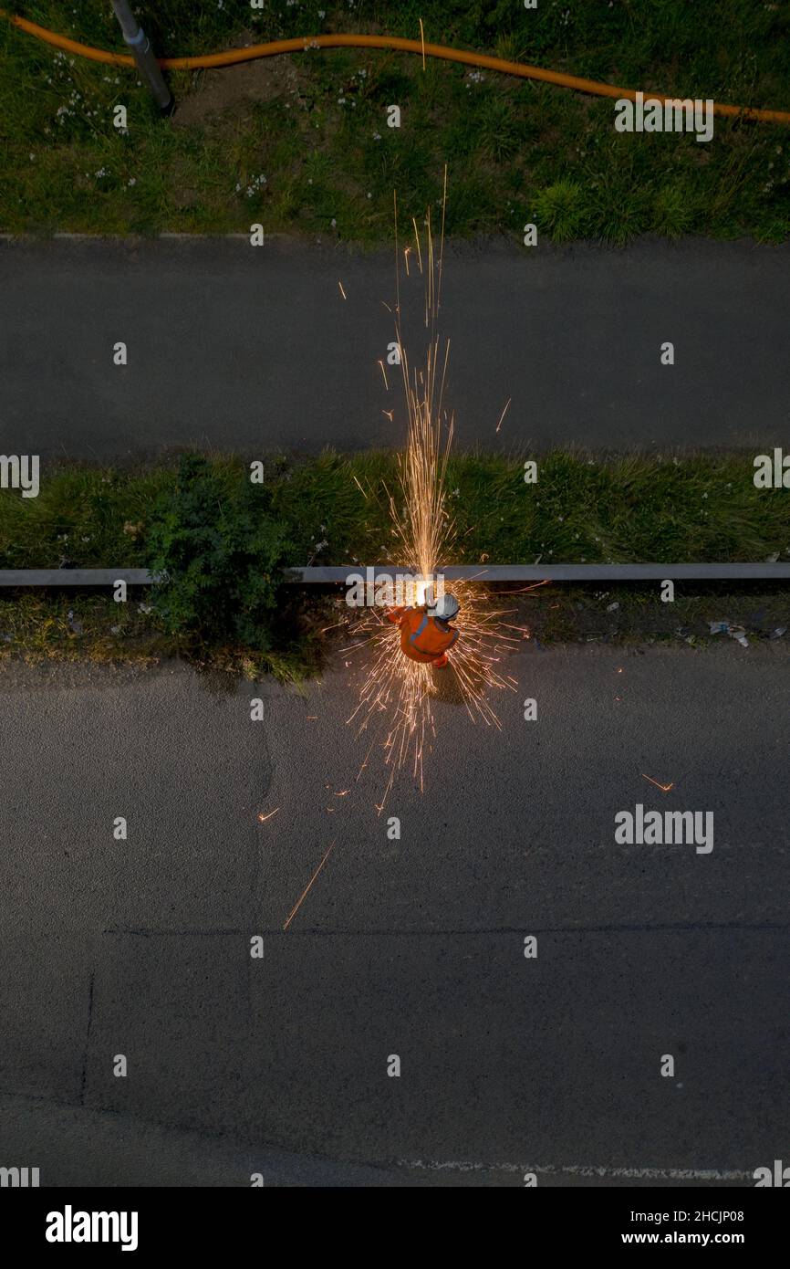 Motorway Worker Cutting Metal Bird's Eye View Stock Photo - Alamy
